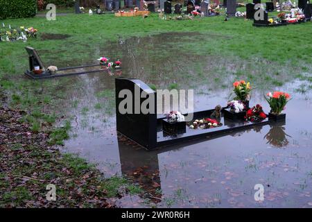 Waterlogged graves at cemetery in Britain, Uk Stock Photo - Alamy
