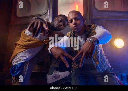 Two emotional guys performing hip-hop style in underground Stock Photo ...
