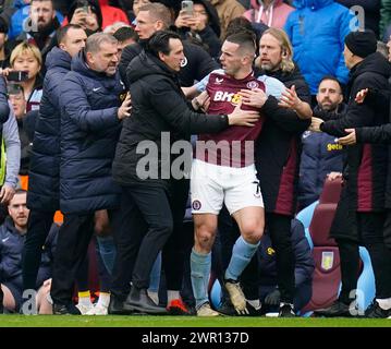 Tottenham Hotspur's Destiny Udogie is held back Manchester United's ...