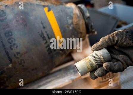Kiel, Germany. 10th Mar, 2024. Two defused aerial bombs lie in an ...