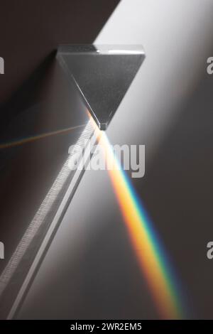 Crystal prism with light diffraction of spectrum colours and reflection ...