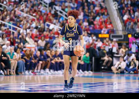 Notre Dame guard Hannah Hidalgo (3) shoots ahead of a screen from teammate Liatu King during the ...