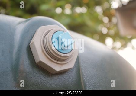 Blue plastic plug for closing the water system on large water tanks ...