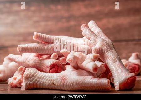 pile of clean chicken feet on a wooden background and copy space Stock ...