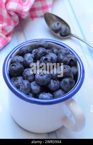 Blueberries in cup, cultivated blueberry Stock Photo - Alamy