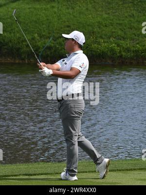 Si Woo Kim, of South Korea, looks at his ball after a shot on the 10th ...