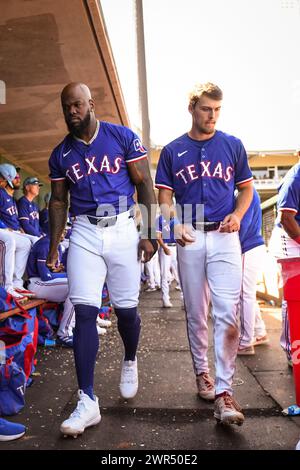 Texas Rangers' Adolis Garcia, left, smiles in the dugout with Marcus ...