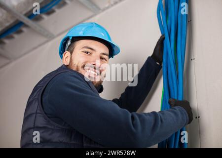 Engineer commissioning bay control unit. Engineering department. Medium ...