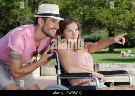 woman in wheelchair pointing into distance Stock Photo - Alamy