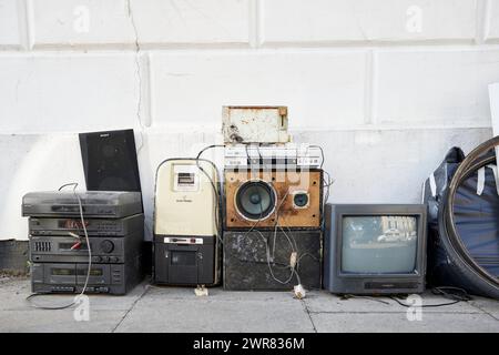 Selection of old electronic equipment dumped on a London street with ...