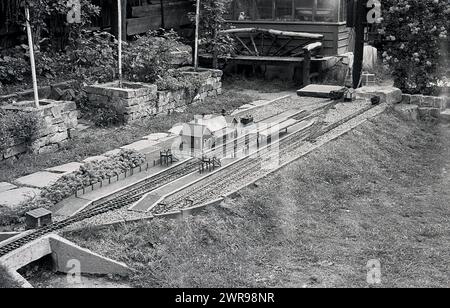 1970s, historical, a model railway built in a back garden, showing the ...