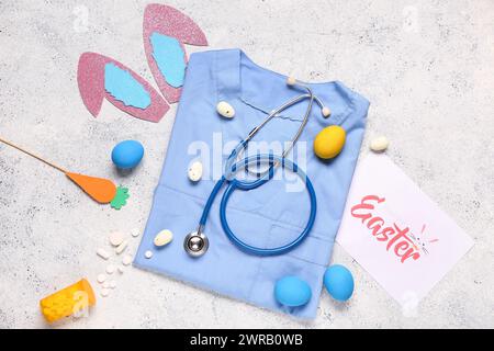 Composition with doctor's uniform, stethoscope, greeting card and ...