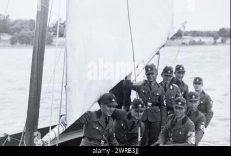 A troop leader and working men of the Reich Labour Service on a sailing ...