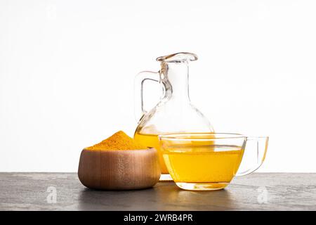Turmeric Powder or Curcuma longa and white spoon with turmeric powder ...