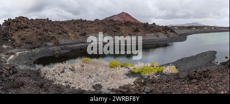 Lagoon on the beach of Montana Bermeja with Bermeja volcano, Lanzarote ...