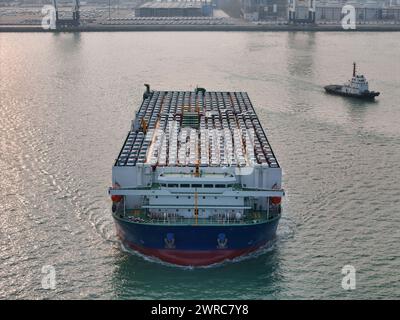 YANTAI, CHINA - MARCH 11, 2024 - A car carrier loaded with cars for ...