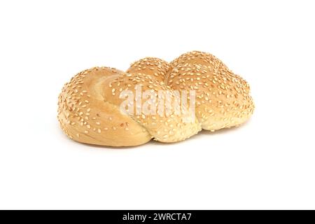Braided sesame bun and a stalks of wheat isolated on white background ...
