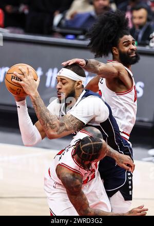 Dallas Mavericks center Daniel Gafford dunks over Phoenix Suns forward ...