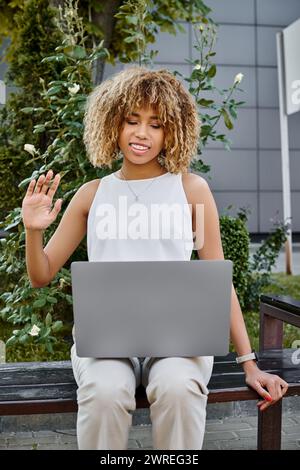African american woman having video call sitting on sofa at home Stock ...