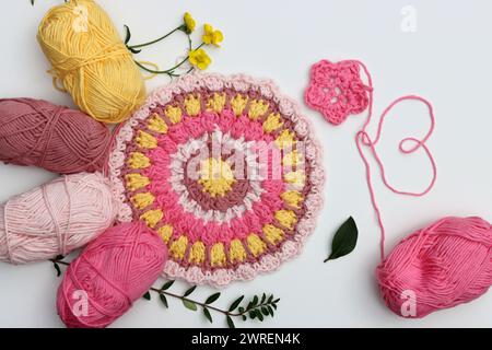 Pink crocheting. Handmade ornament made of organic pink yarn. White ...