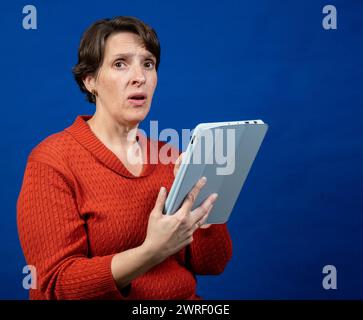 Portrait of sad and worried woman working on laptop Stock Photo - Alamy