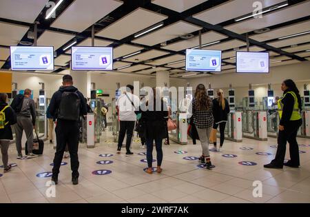 Arrivals at the passport gates at Gatwick Airport where biometric ...