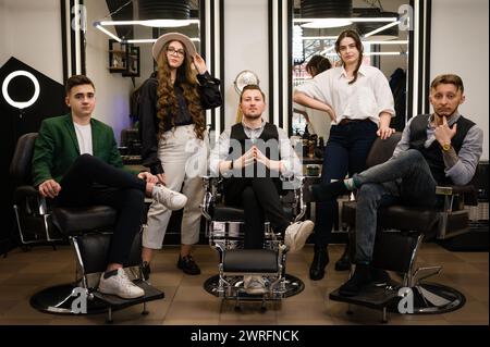 Portrait of a professional barbershop team. Five hairdressers stylists ...