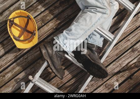 Fallen worker and ladder concept Stock Photo - Alamy
