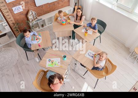 Top view kindergarten children during art lesson Stock Photo - Alamy