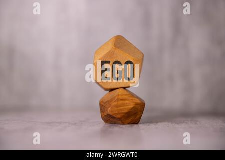 The word ego written in cubes on a wooden background Stock Photo - Alamy
