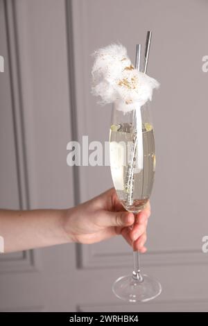Glass with delicious cotton candy cocktail on color background Stock ...