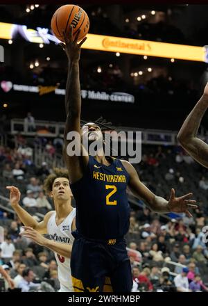 West Virginia guard Kobe Johnson drives up court during an NCAA college ...