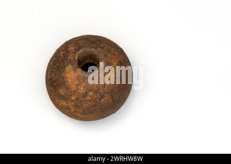 Rusted cannonball with white background Stock Photo - Alamy