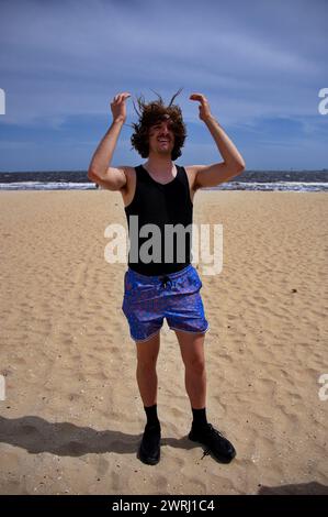 Portrait of man standing on sandy beach. bearded man at beach Stock ...