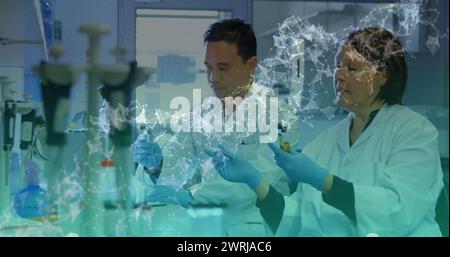 Image of rotating DNA strand and over scientist wearing lab coat ...