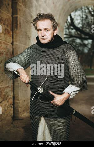 Medieval infantry armed man on guard in castle gateway Stock Photo - Alamy