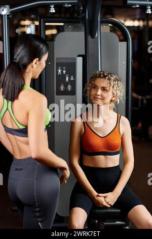 beautiful female coach explaining to her appealing jolly client how to ...