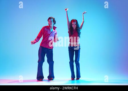 Rock and roll era. Elegant stylish young couple dancing retro dance ...