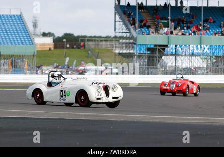 Christopher Scholey driving his White, 1954, Jaguar XK120, in the ...