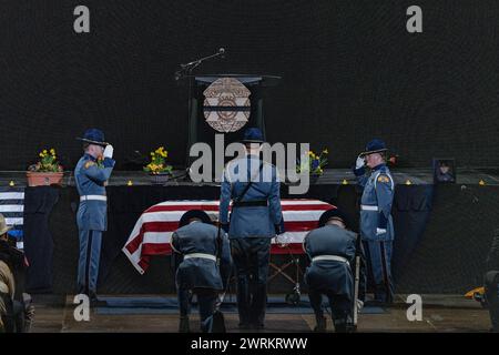 Washington State Patrol troopers solemnly perform a ceremony honoring ...