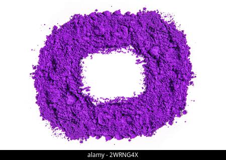 a bunch of dry natural purple pigment on a white background macro ...