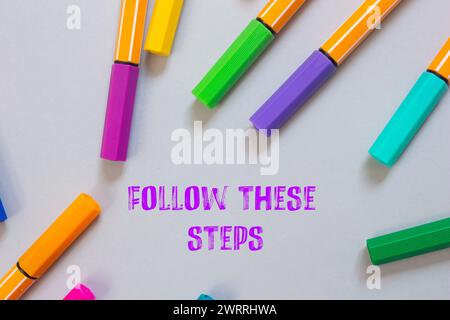 Follow these steps words written on torn paper piece with green ...