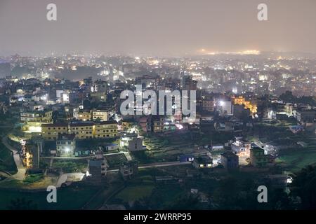 Aerial night Kathmandu cityscape with lot of low rise buildings with ...