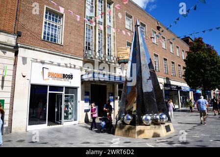 View of the Exeter Riddle sculpture along High Street in the city ...