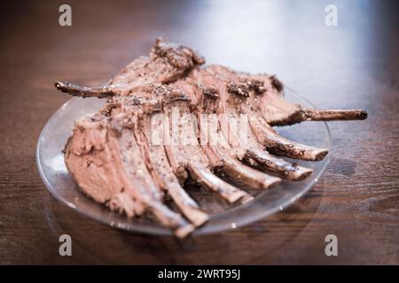 Frenched rack of lamb on a served on a plate Stock Photo - Alamy
