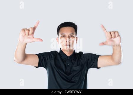 Football referee showing VAR symbol on white background Stock Photo - Alamy