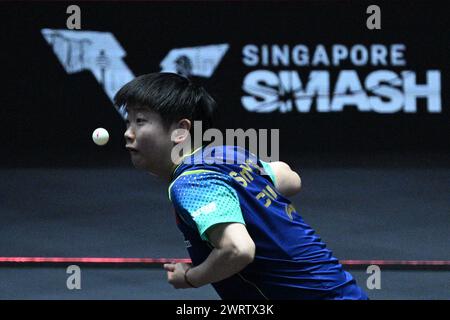 Singapore. 14th Mar, 2024. Sun Yingsha/Wang Chuqin (L) of China compete ...