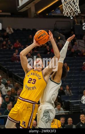 Minnesota forward Parker Fox (23) shoots against Wisconsin forward ...