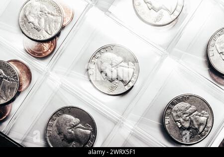 top view of coins in a plastic box on white background Stock Photo - Alamy