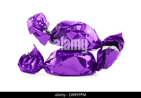 Candies in purple wrappers isolated on white Stock Photo - Alamy